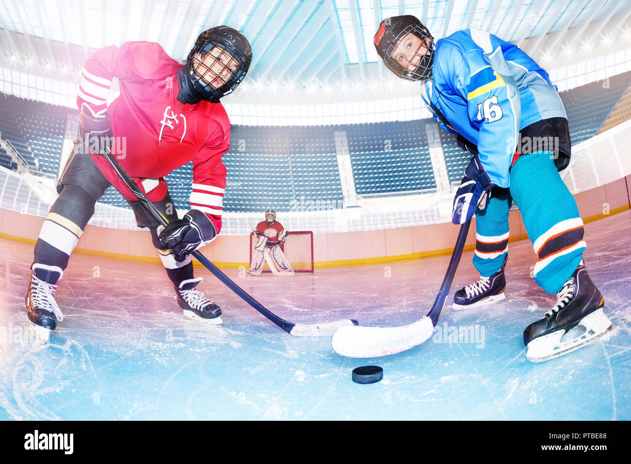 Low angle portrait of teenage boys, hockey players, challenging for the ...