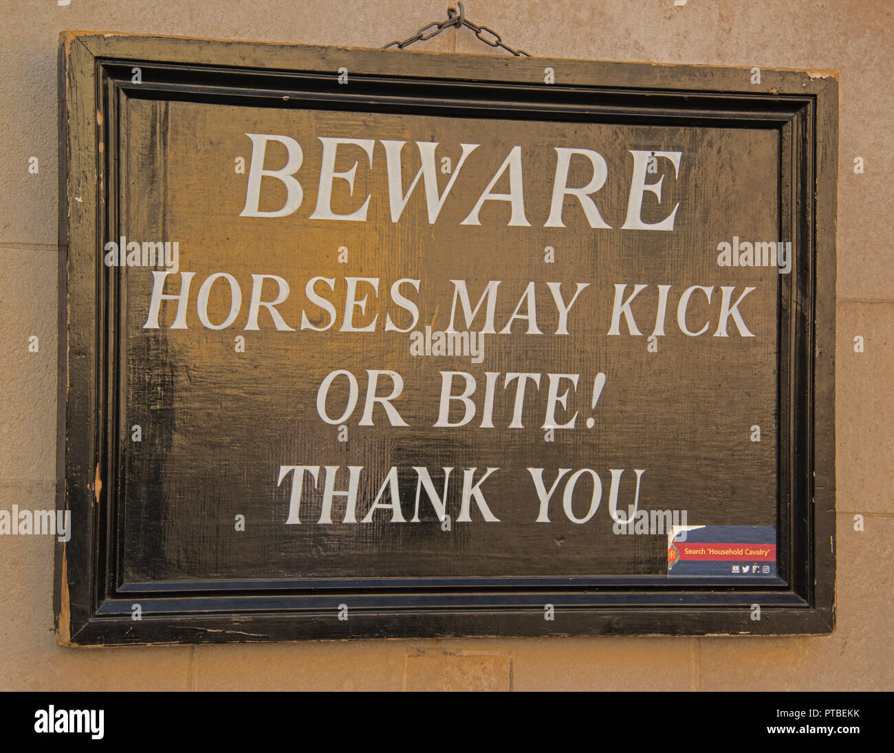 Horses 'Kick or Bite' sign Stock Photo - Alamy