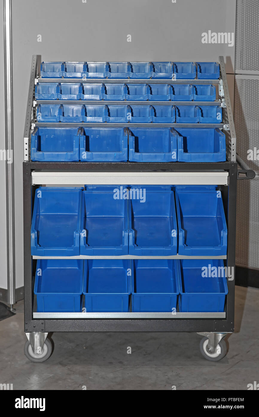 Sorting Cart With Blue Bins in Service Garage Workshop Stock Photo - Alamy
