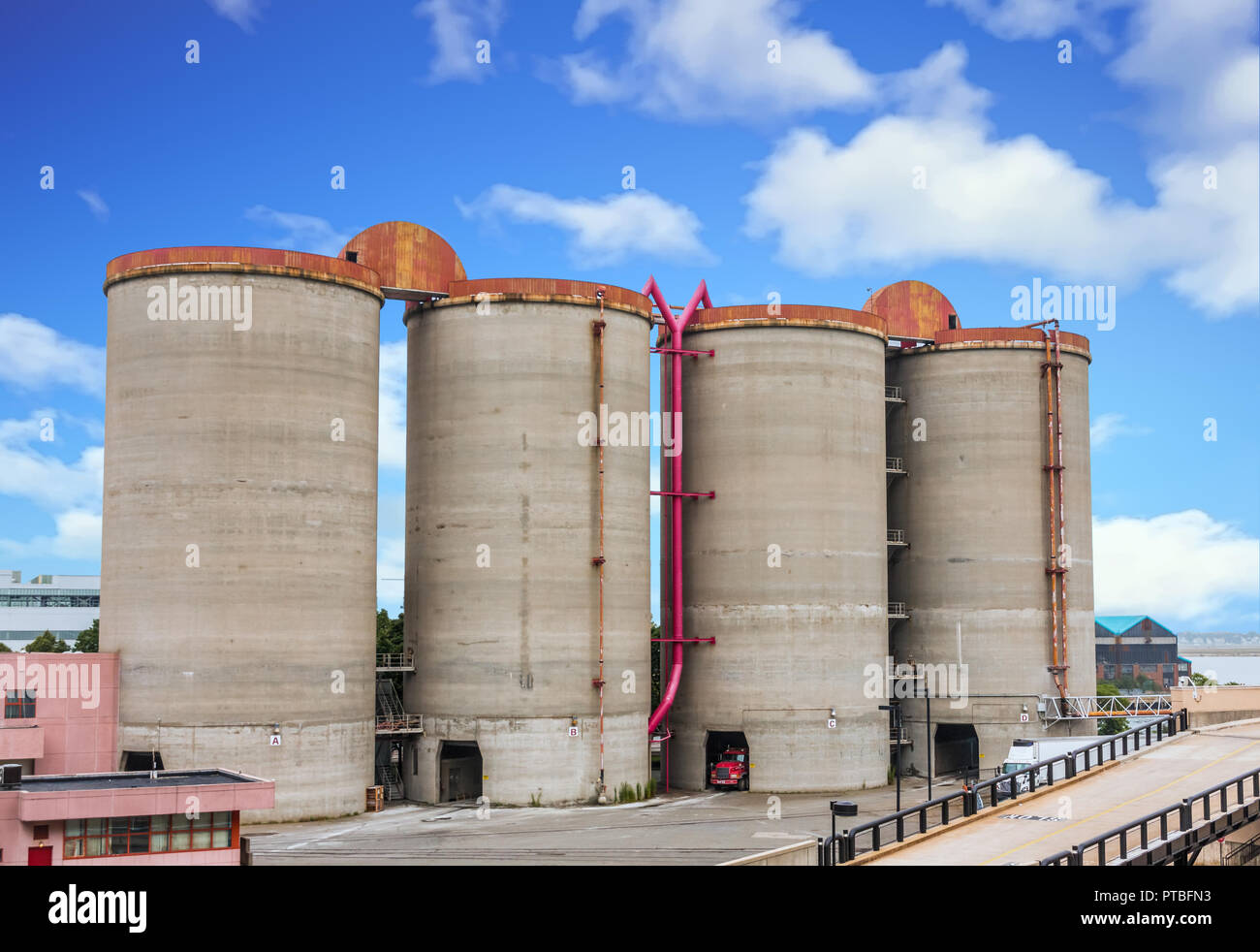 Four Concrete Silos in Boston Harbor Port Stock Photo - Alamy