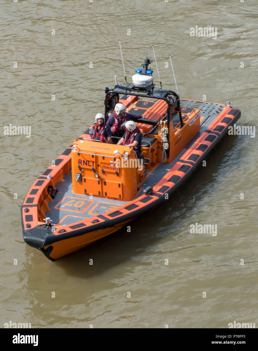 the RNLI lifeboat on the river thames in central London. royal national ...