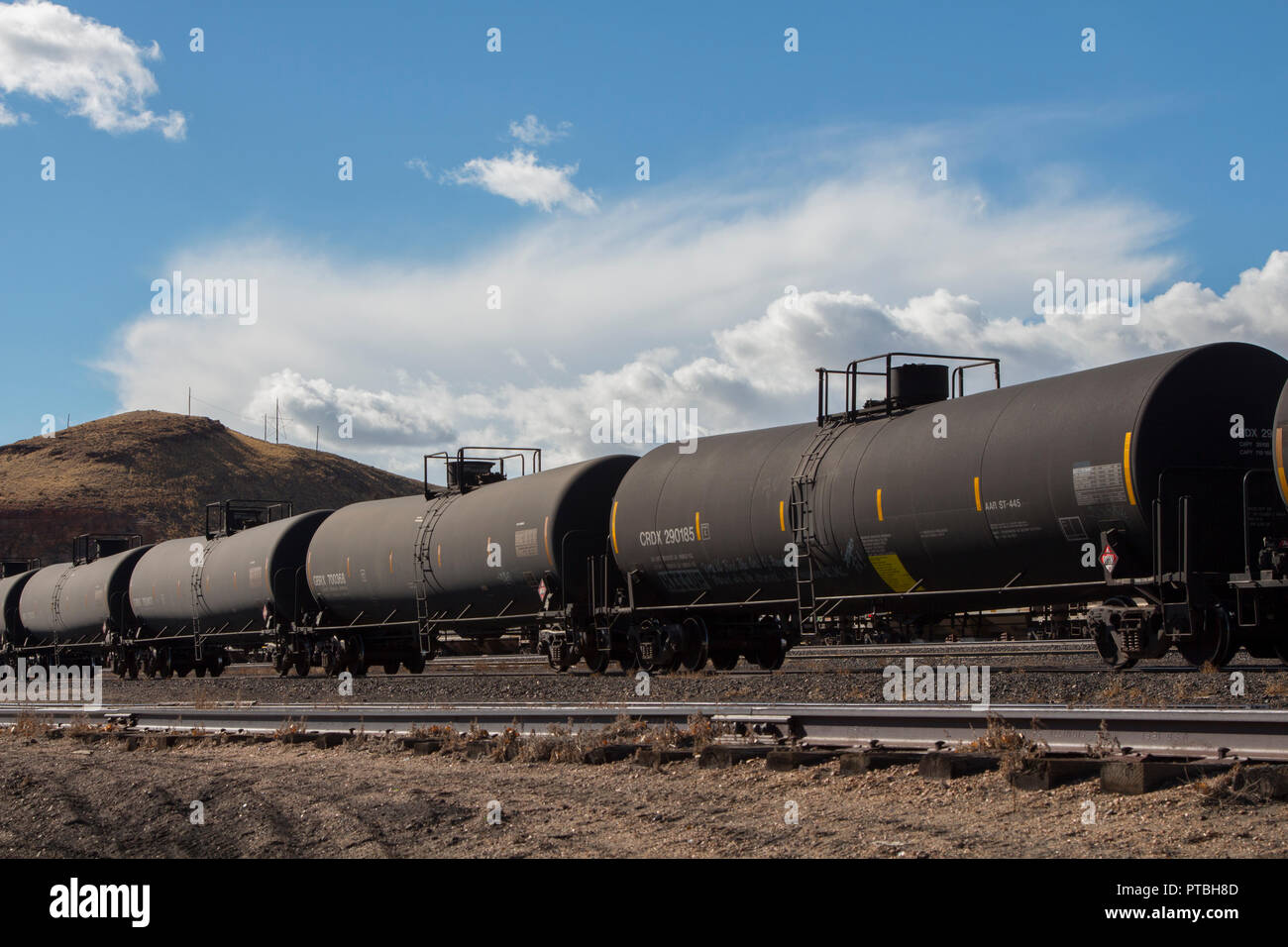 Railroad tank cars carrying hazardous materials on a siding in a train ...