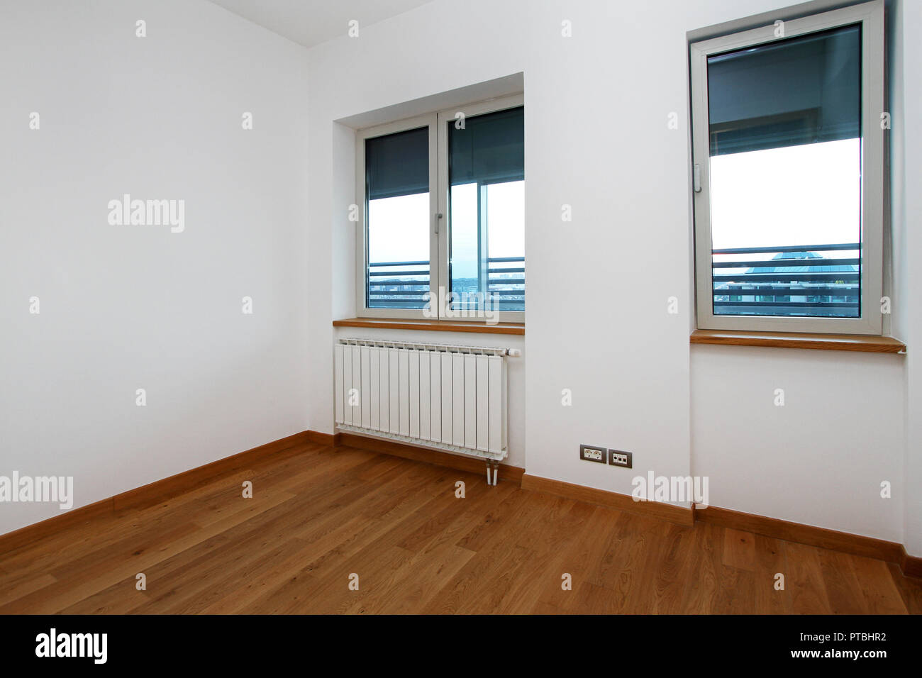 New empty small room in renovated home Stock Photo - Alamy