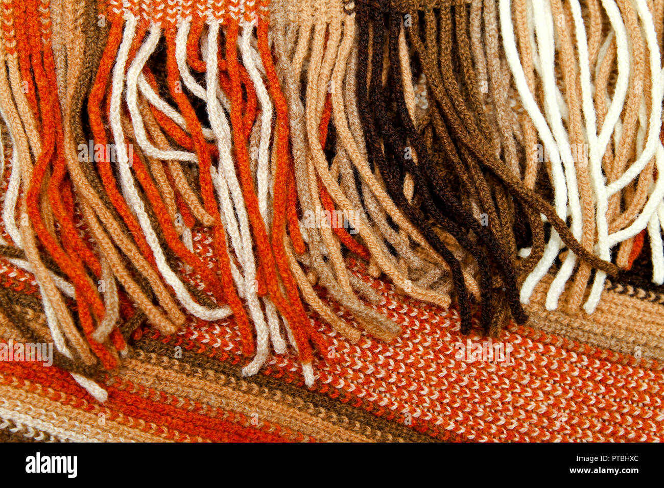 Fringes on colourful Kashmiri knitted wool scarf Stock Photo - Alamy