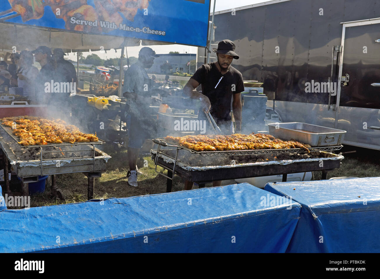 African american male cooking chicken hi-res stock photography and ...