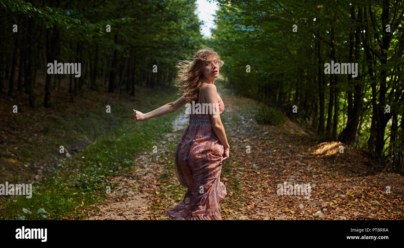 Scared woman running hi-res stock photography and images - Alamy