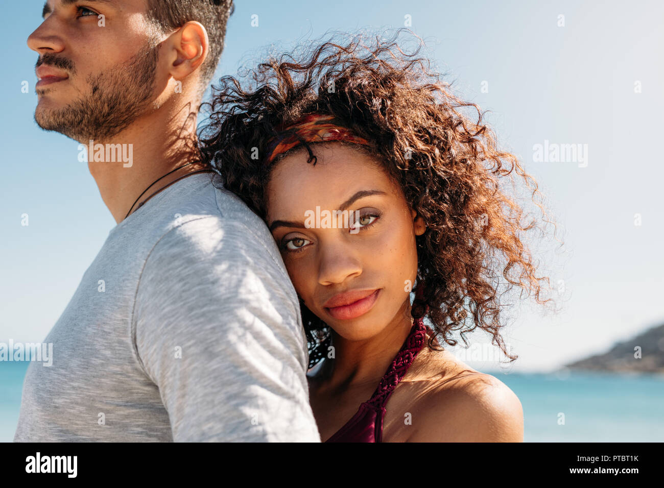 Woman Standing Over Man