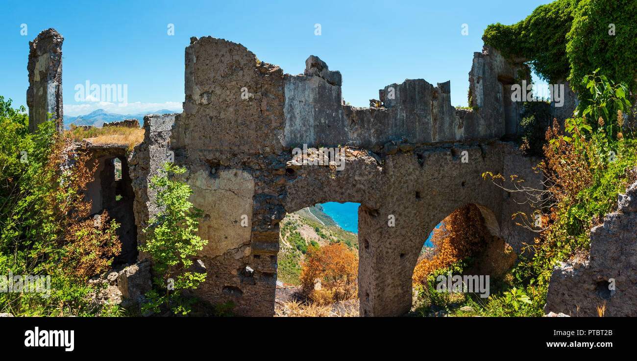 The ruins of the original settlement of Maratea on a rocky escarpment ...