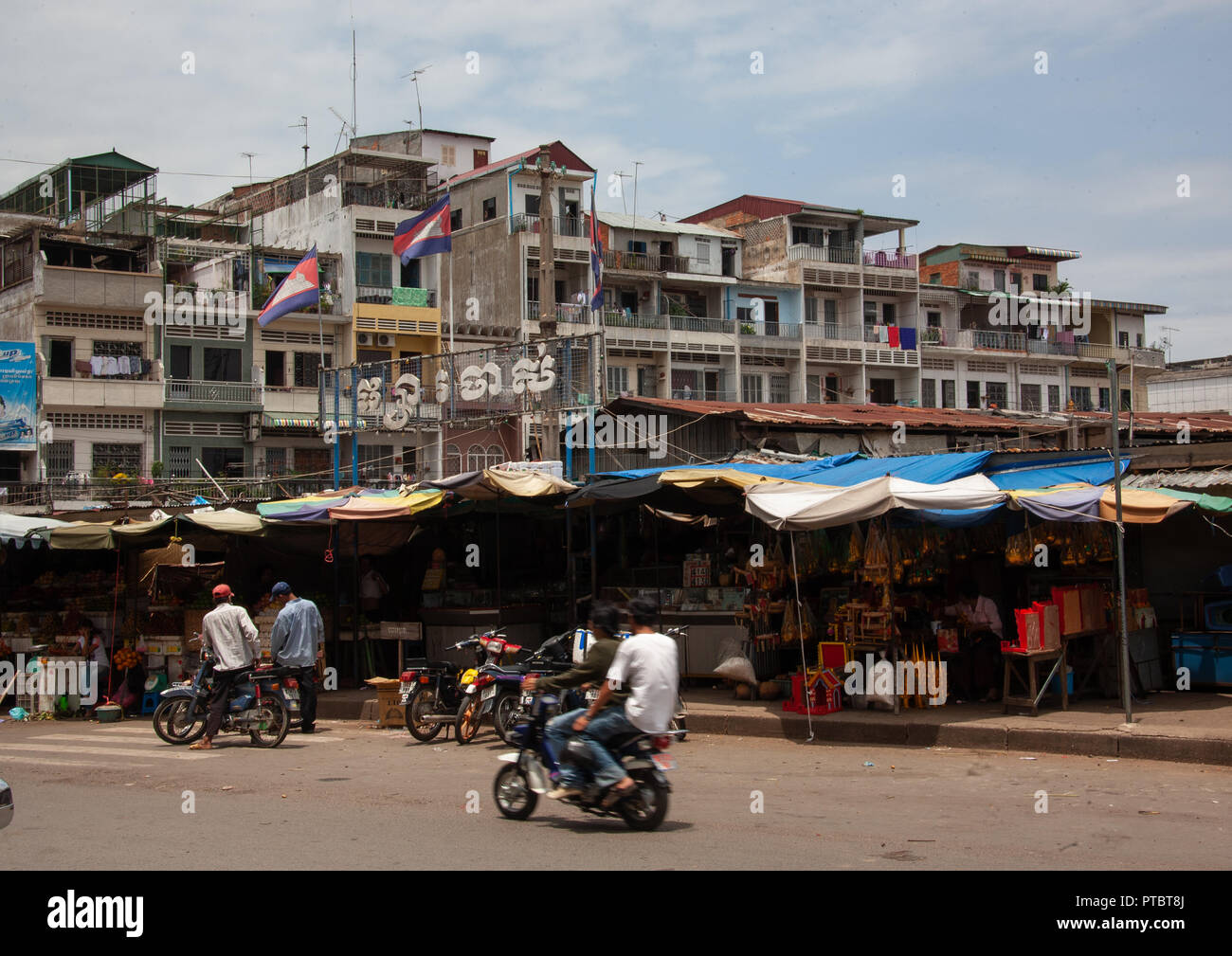 Market stalls in front of old colonial buildings, Phnom Penh province ... Market stalls in front of old colonial buildings, Phnom Penh province ...