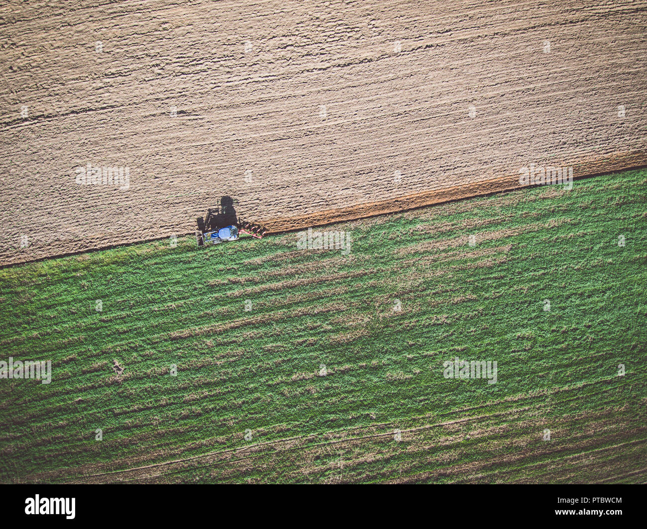 Side view of tractor with plough hi-res stock photography and images ...