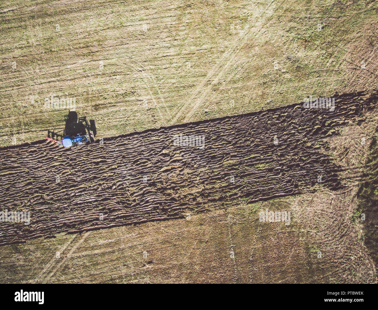 Side view of tractor with plough hi-res stock photography and images ...