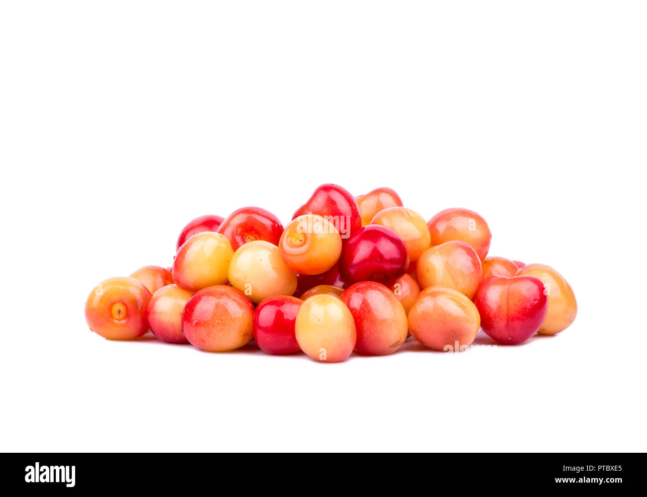 Pile of fresh yellow red cherries on a white background Stock Photo - Alamy