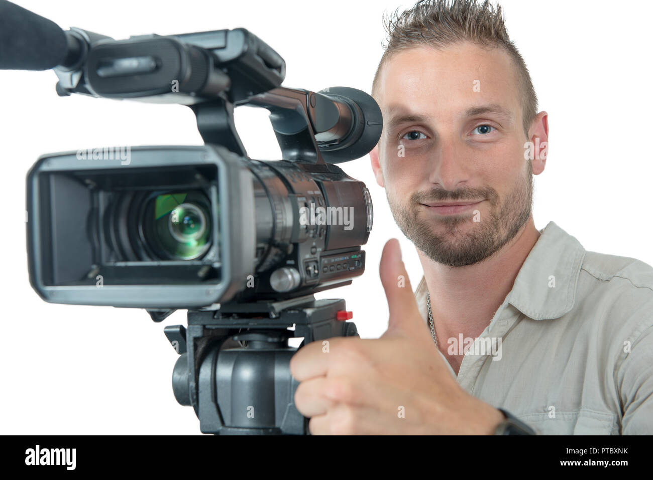 a cameraman with professional camcorder make OK sign isolated on white ...