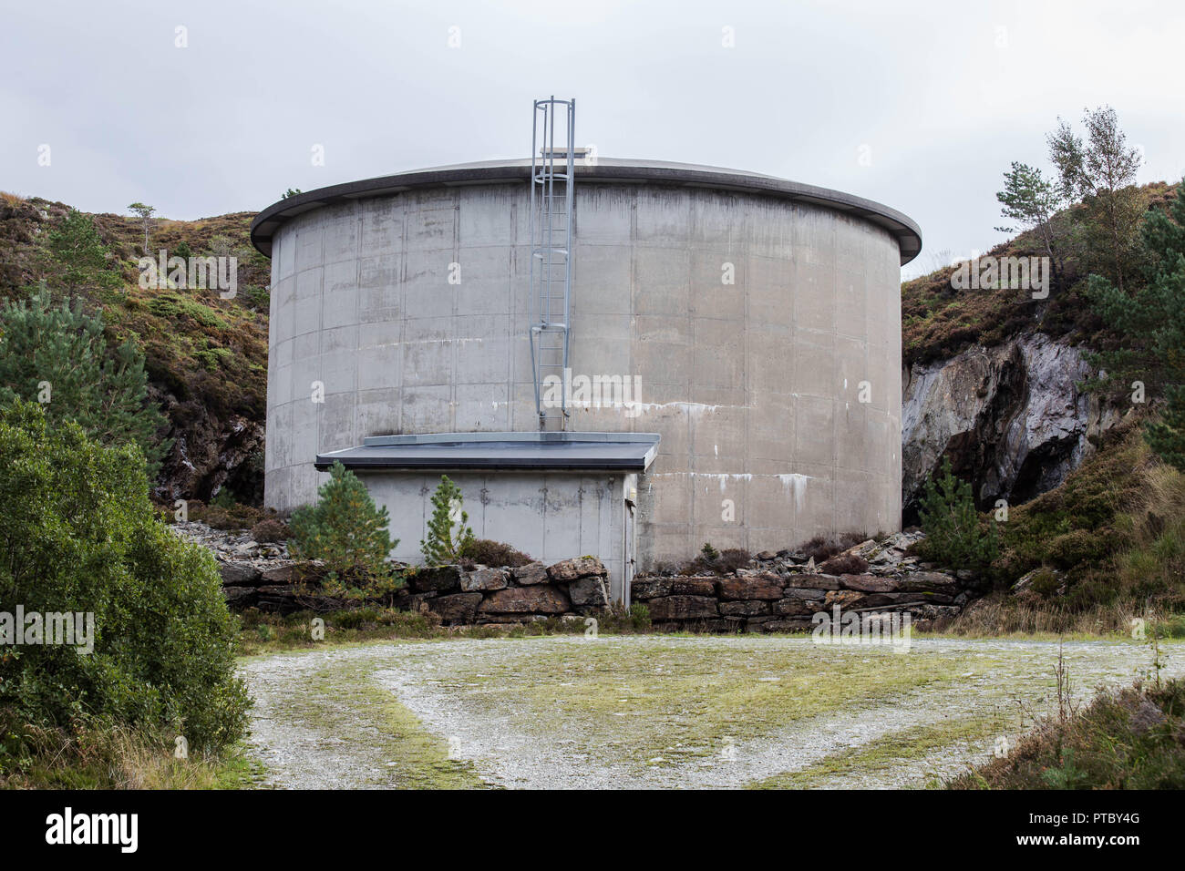 Old rustic water tower with gloomy overcast background Stock Photo - Alamy
