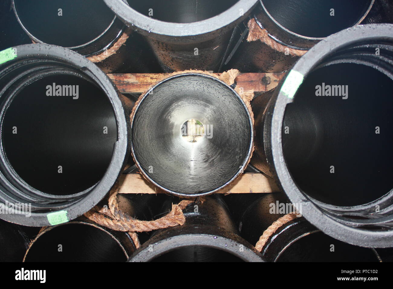 Looking inside a long black pipe with light at the end of the line ...