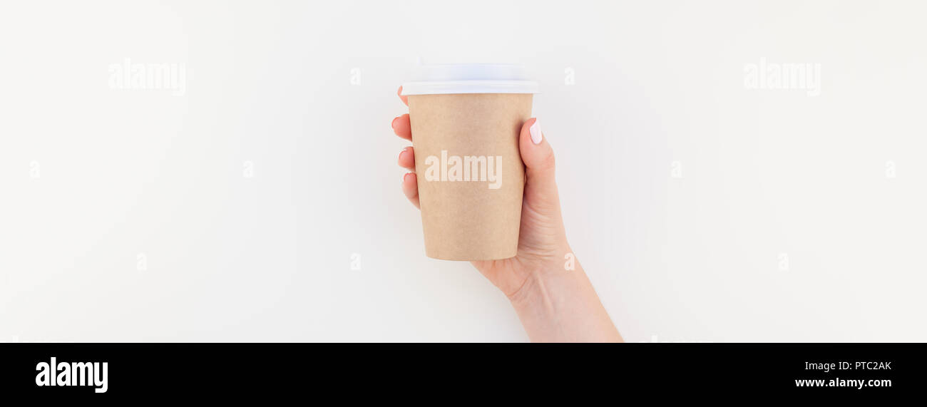 Long wide banner mock up of woman hand holding craft paper coffee cup ...