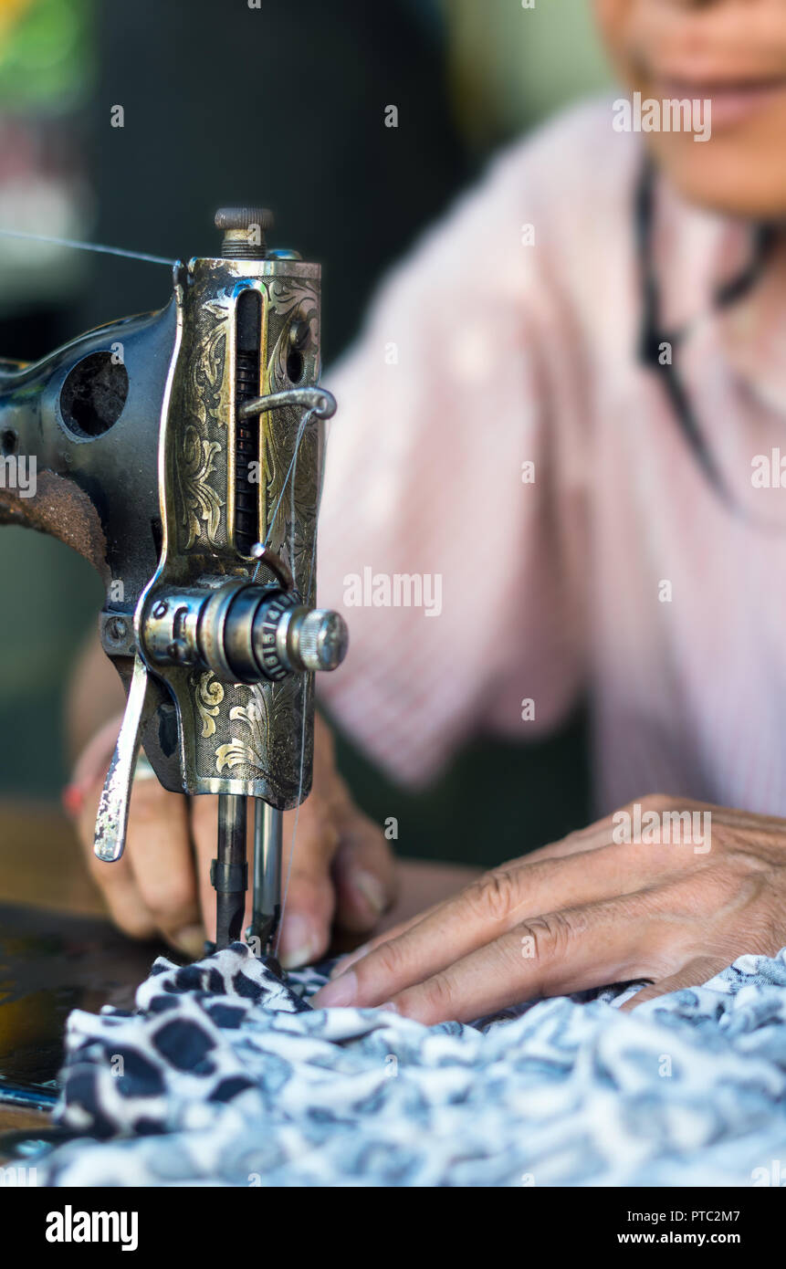 Sewing Process by hand with old man designer blur background Stock ...