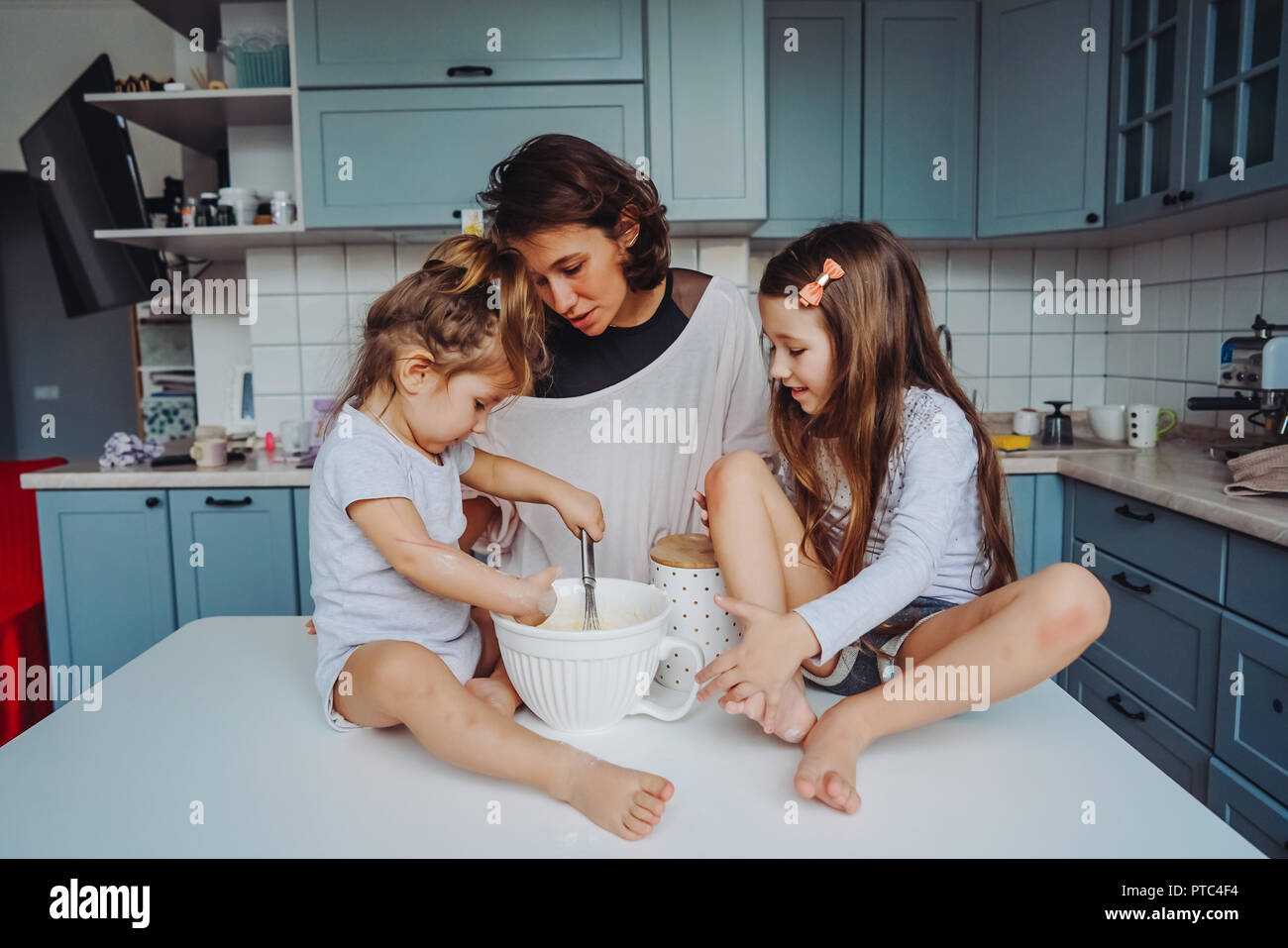Happy family cook together in the kitchen Stock Photo - Alamy