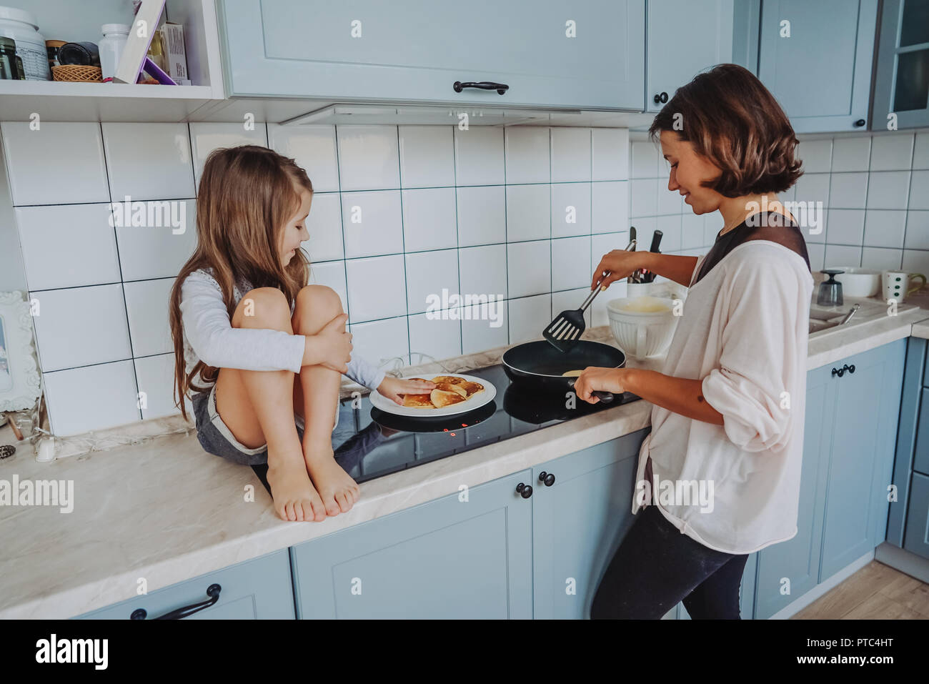 happy family cook together in the kitchen Stock Photo - Alamy