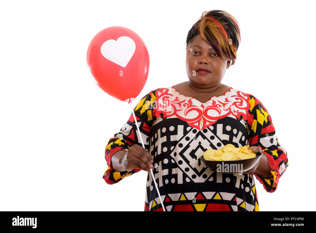 Studio shot of fat black African woman holding bowl of potato ch Stock ...