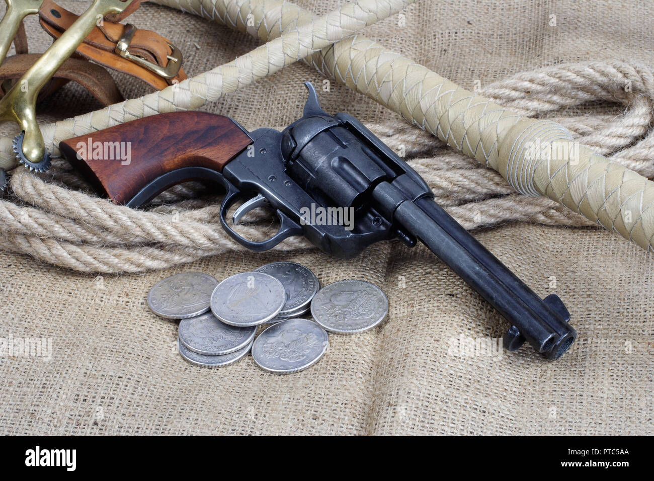 wild west revolver - colt single action army with silver dollars on ...