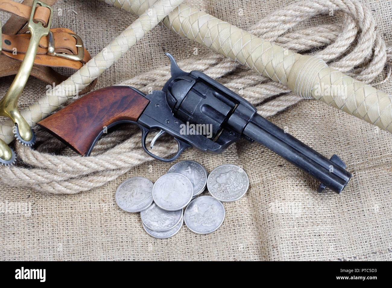wild west revolver - colt single action army with silver dollars on ...