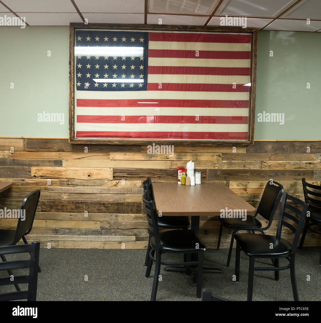 American Flag framed and hanging on the wall at a small town country ...