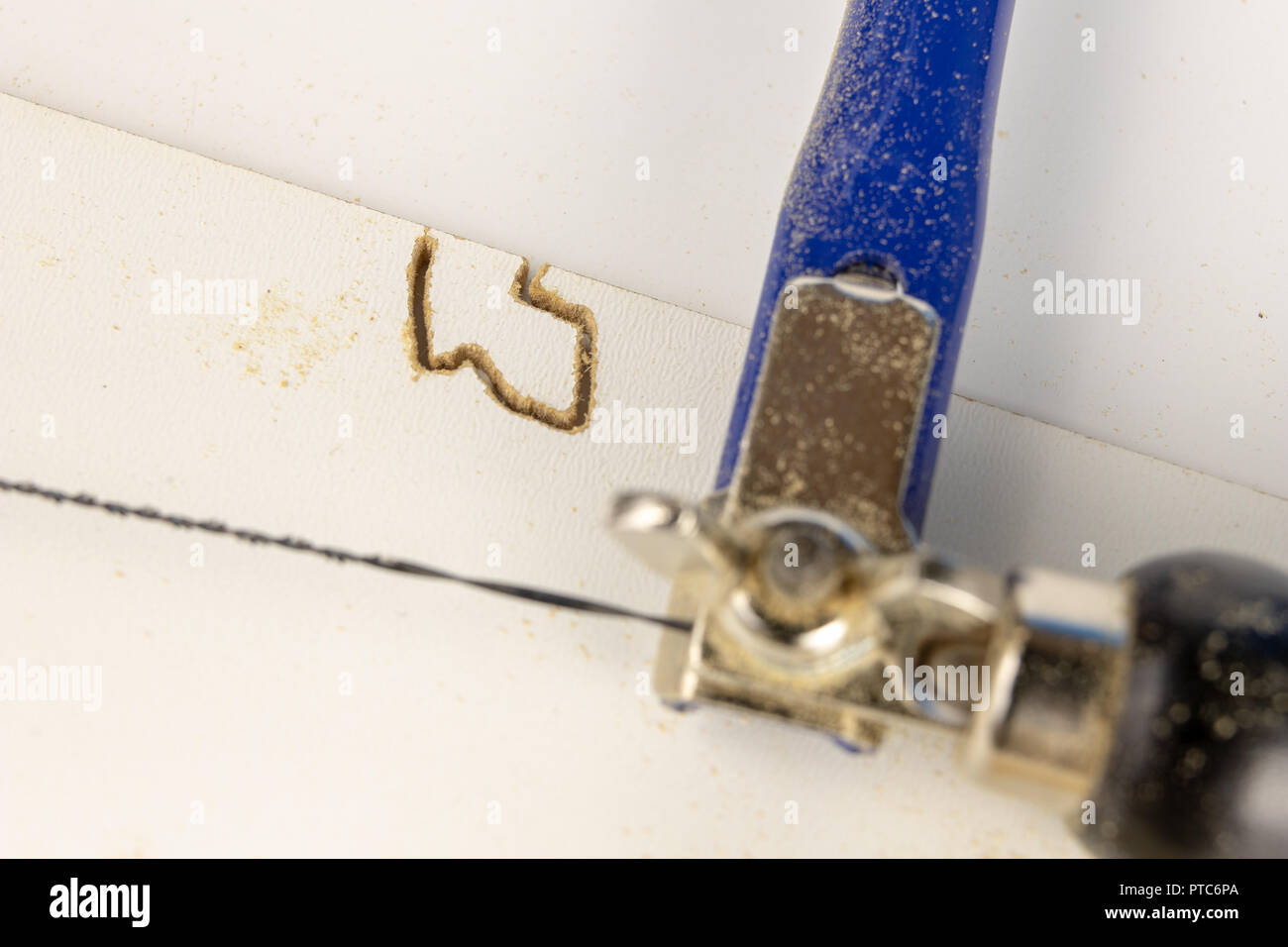 Precise saw for modelers and carpenters on the workshop table. Saw with ...