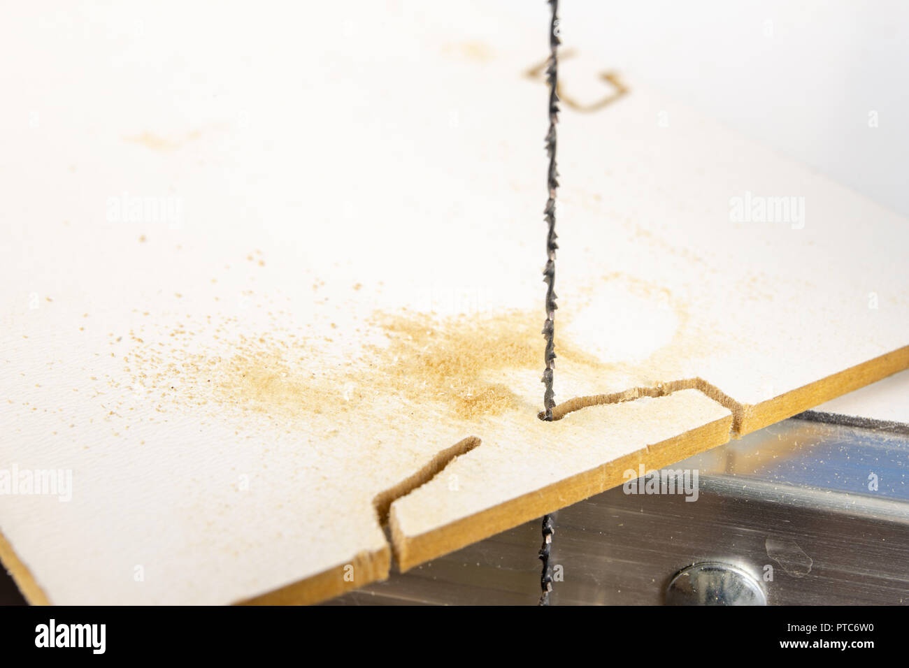 Precise saw for modelers and carpenters on the workshop table. Saw with ...