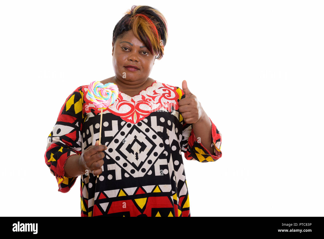 Studio shot of fat black African woman holding heart shaped loll Stock ...