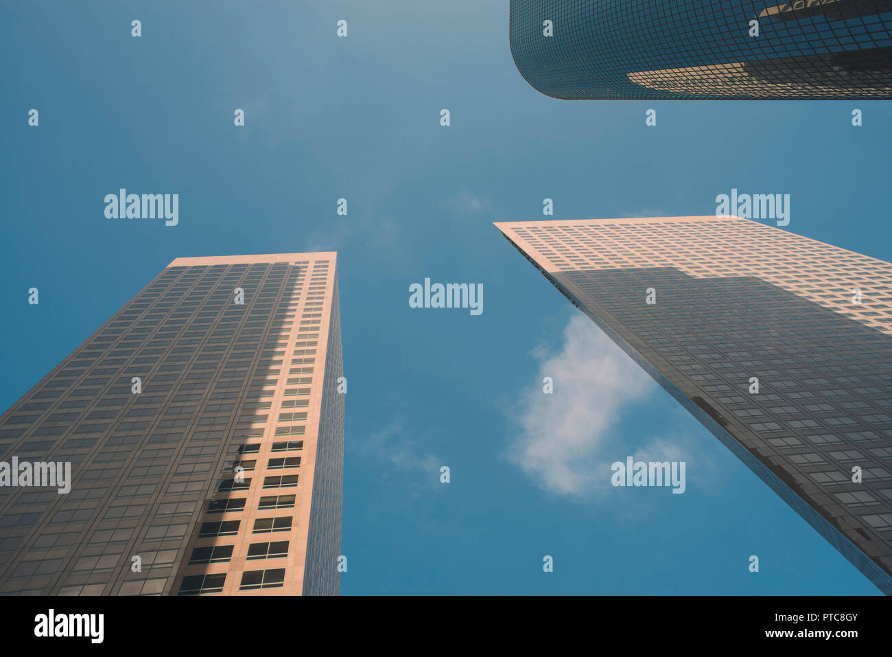 A group of three tall buildings in a large city Stock Photo - Alamy