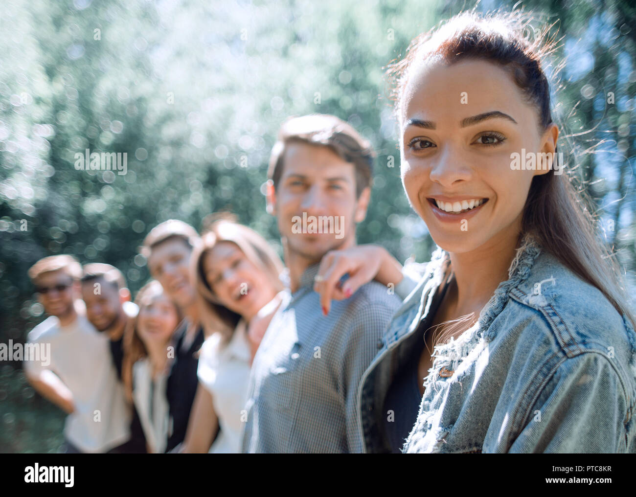 side view of a group of serious young men standing together Stock Photo ...