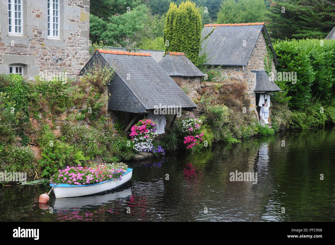 Floral displays by traditional riverside wash houses, Pontrieux ...