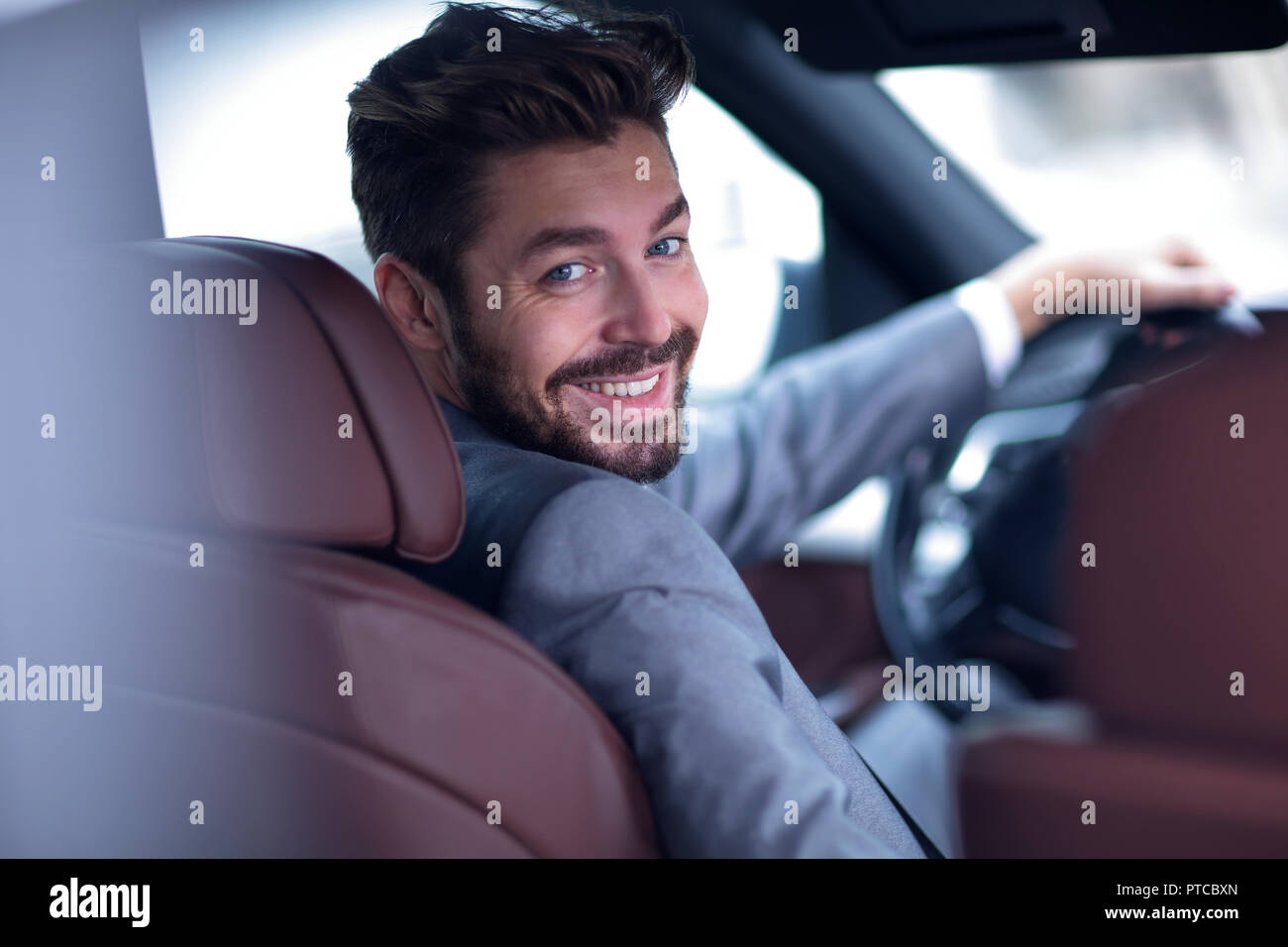 Successful man sitting behind hi-res stock photography and images - Alamy
