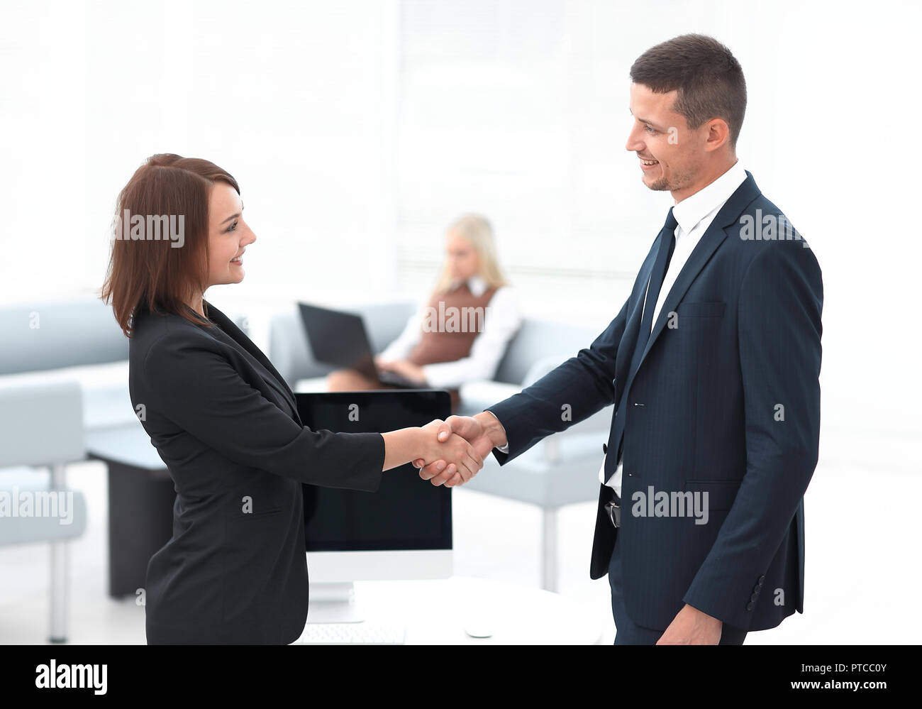 handshake business partners at the negotiating table Stock Photo - Alamy