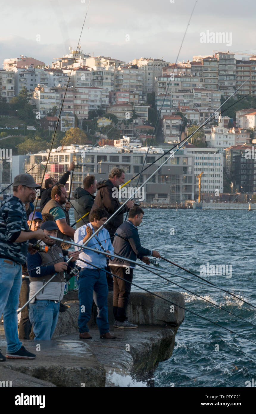 Turkish men recreational fishing along the Bosphorus in Istanbul ...