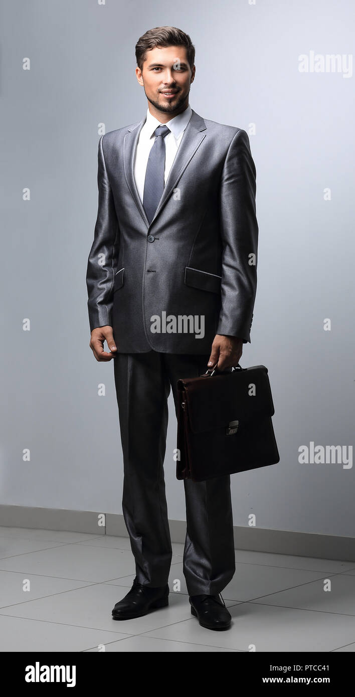 portrait in full growth. a successful business man Stock Photo - Alamy