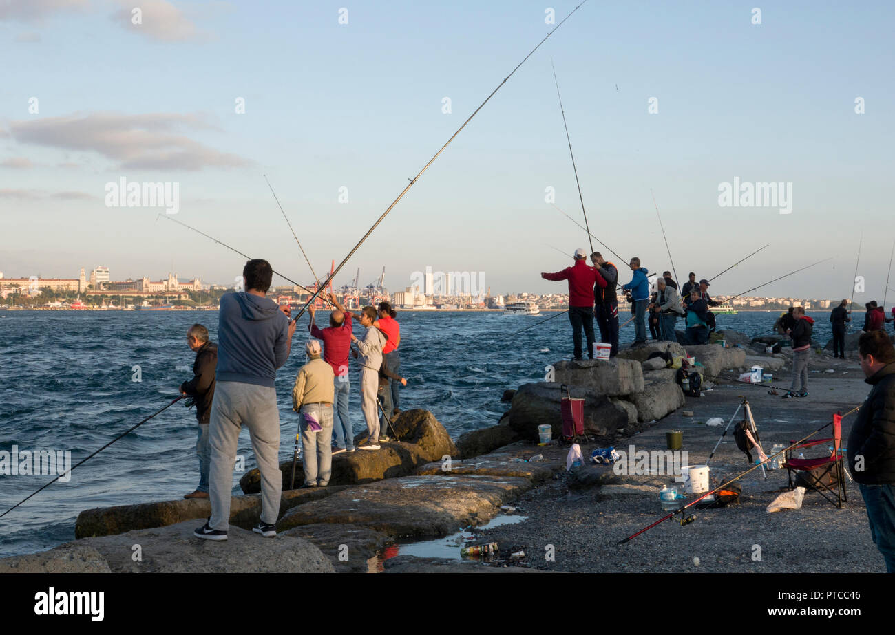 Turkish men recreational fishing along the Bosphorus in Istanbul ...