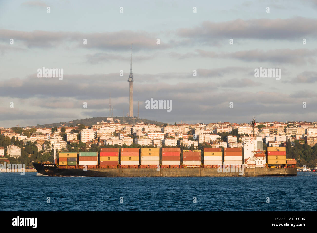 Container ship passing through the city along the Bosphorus in Istanbul ...