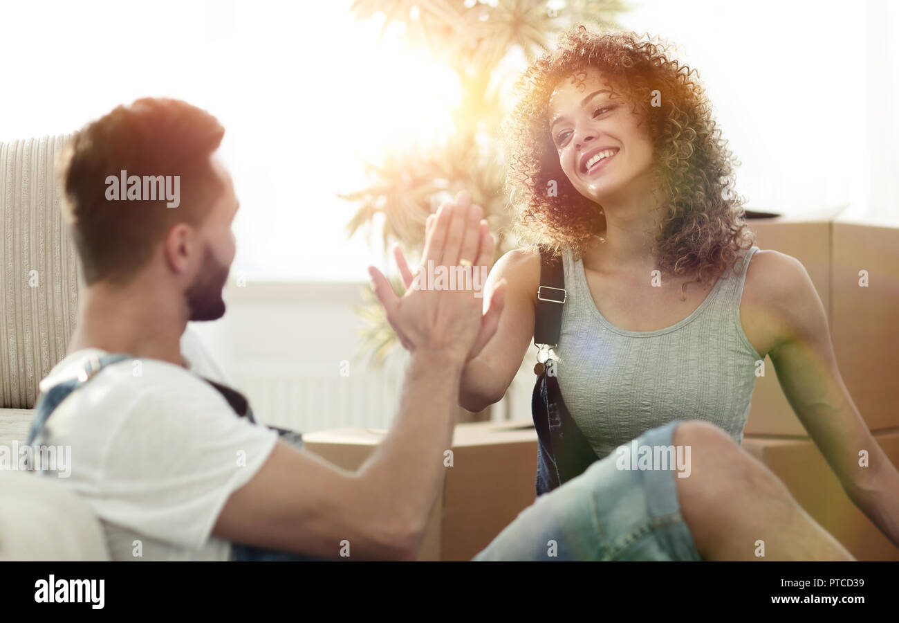young couple giving each other five with a new home Stock Photo - Alamy