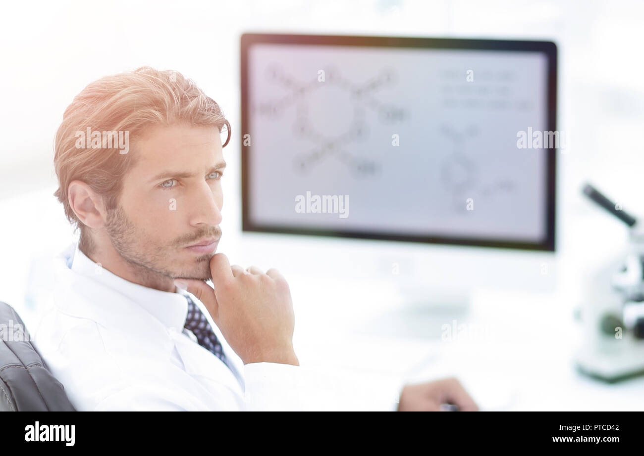 Scientist using computer and microscope in the laboratory Stock Photo ...