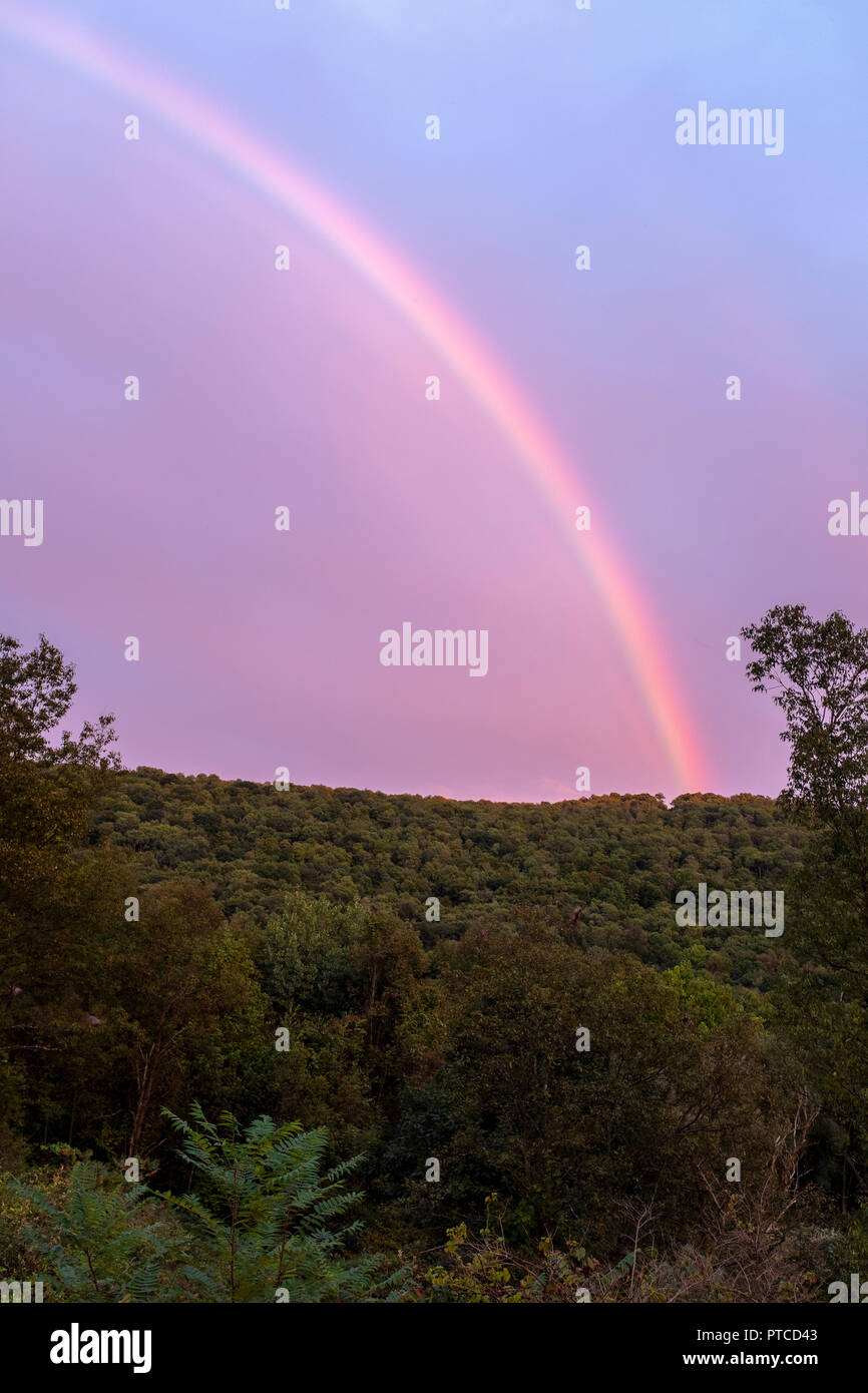 rainbow over a mountain Stock Photo - Alamy