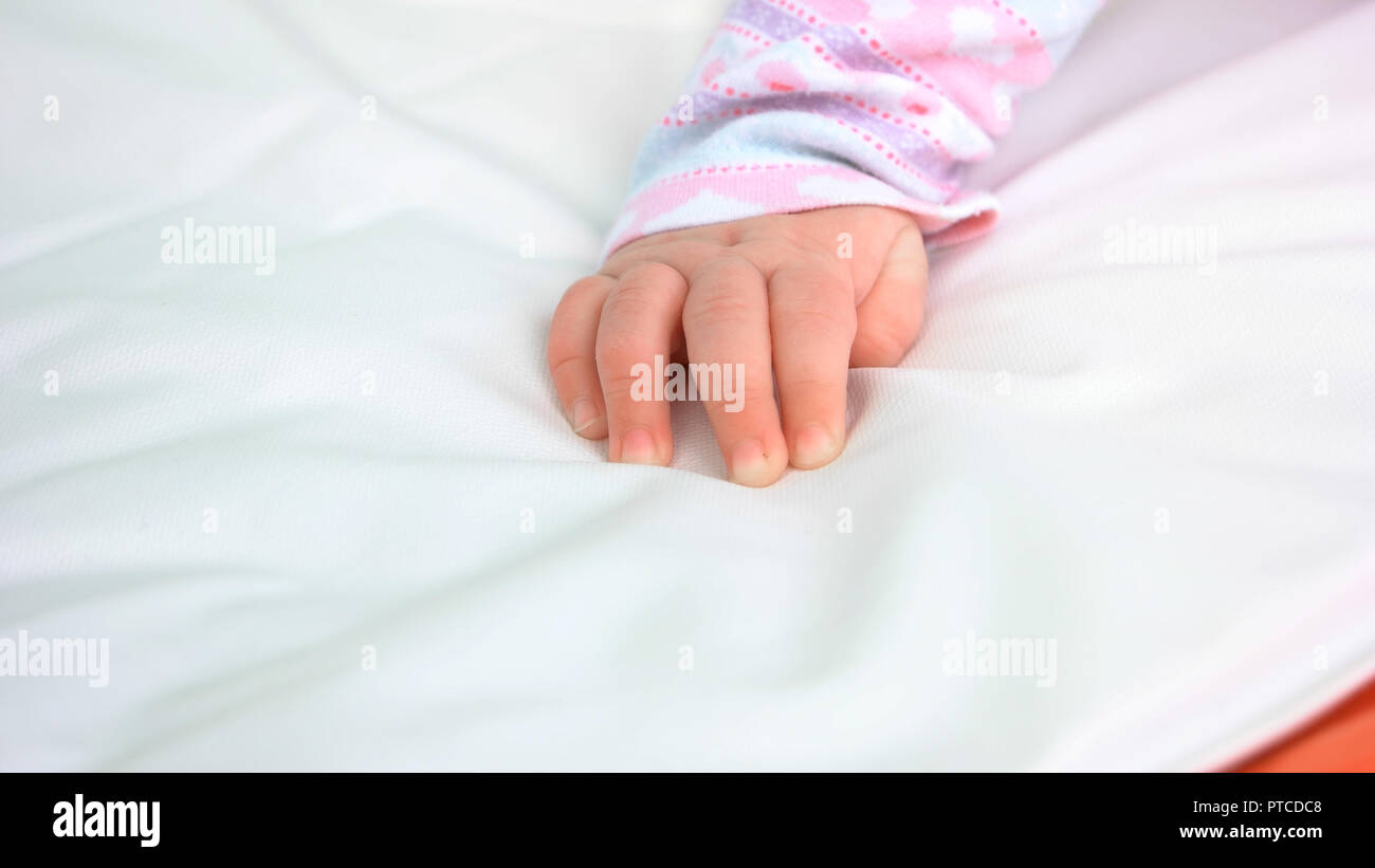 Hand of infant baby girl. Hand of newborn caucasian kid on white ...