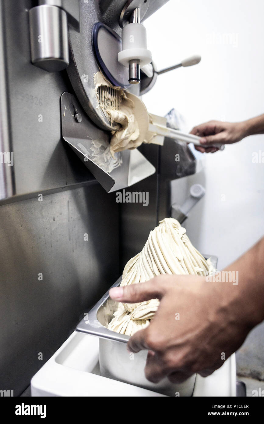 making gelato ice cream with modern professional equipment preparation ...
