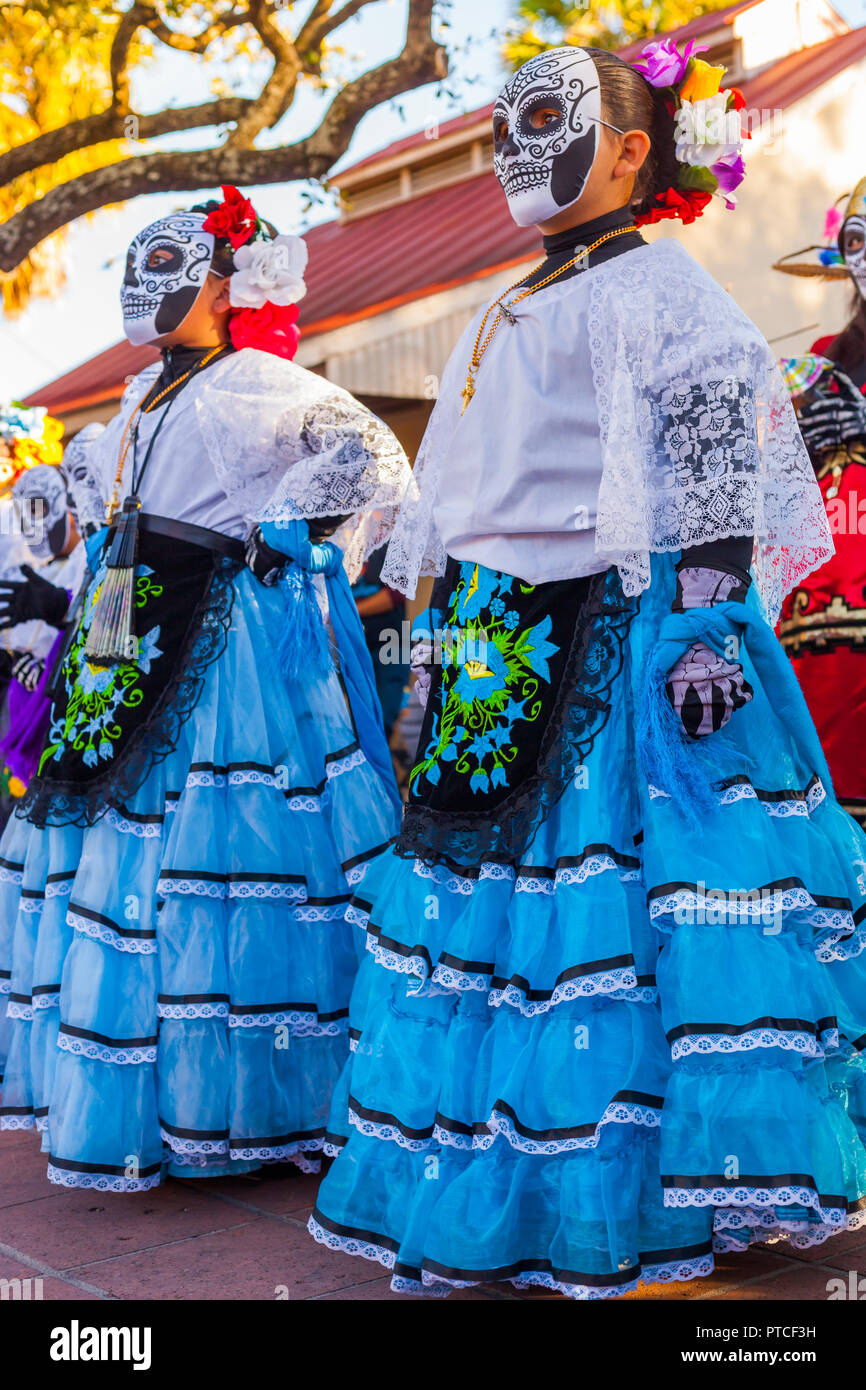 Group of unrecognizable women wearing traditional sugar skull masks and ...