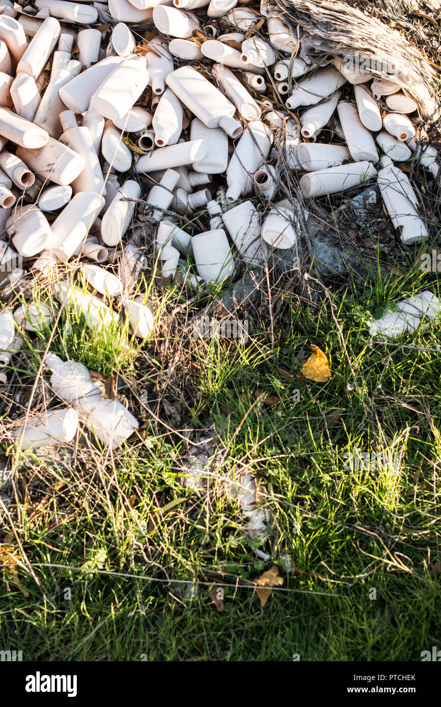 Many white plastic waste on grass. Industrial waste Stock Photo - Alamy