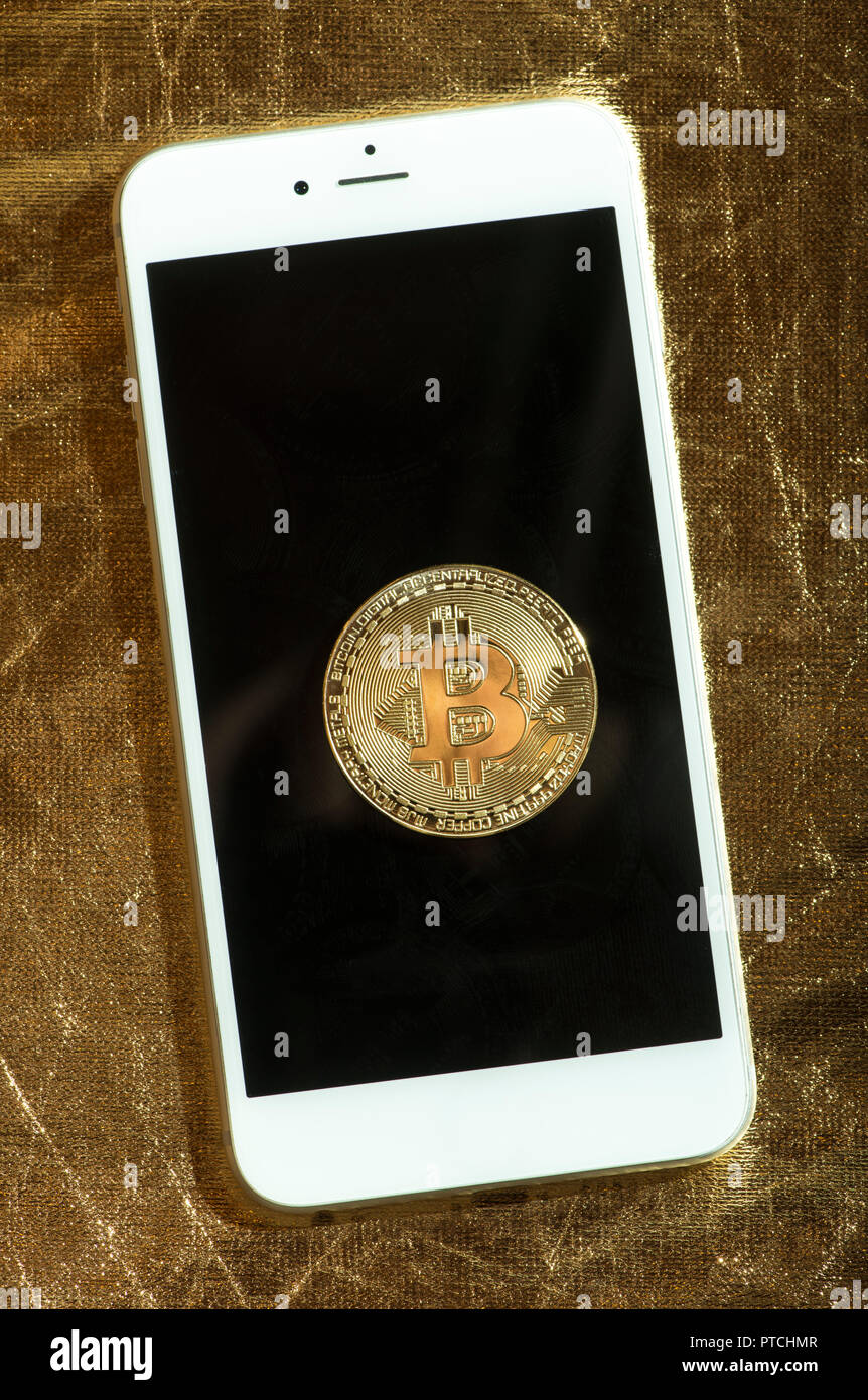 Bitcoin and smartphone on gold background Stock Photo - Alamy