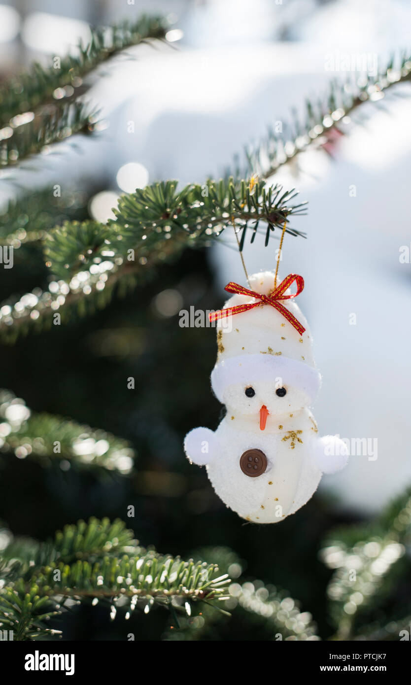 Snowman on fir branch Stock Photo - Alamy