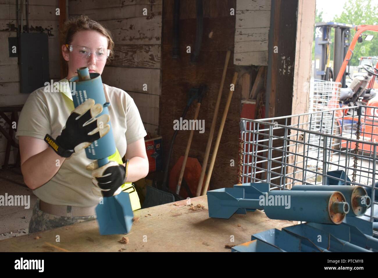 A soldier from the 221st Ordnance Company prepares materials for ...