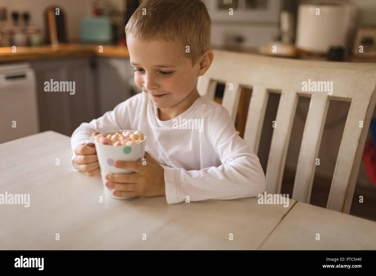 Boy holding a cup hi-res stock photography and images - Alamy